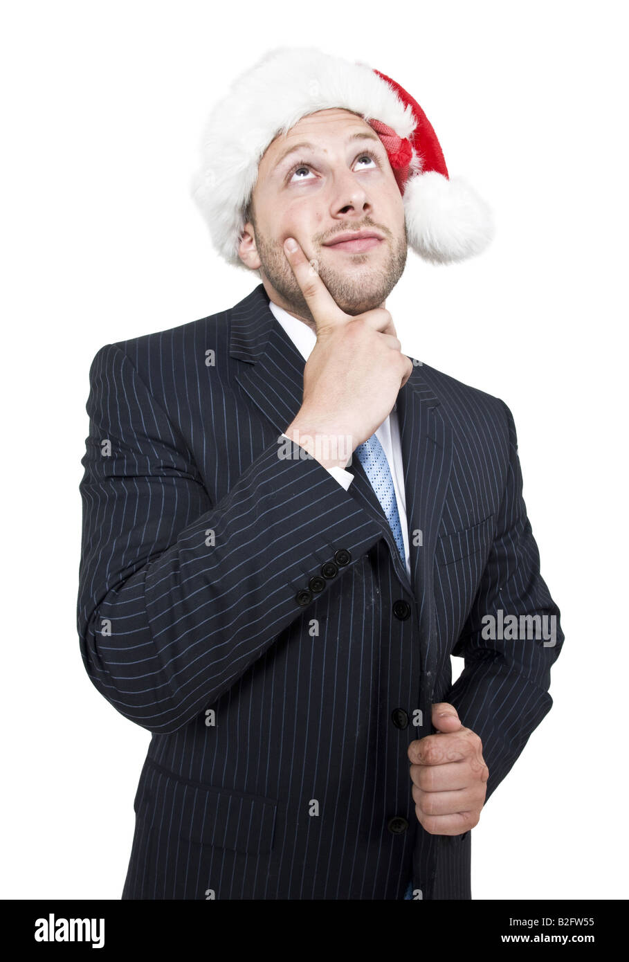 thinking businessman with Santa cap Stock Photo - Alamy