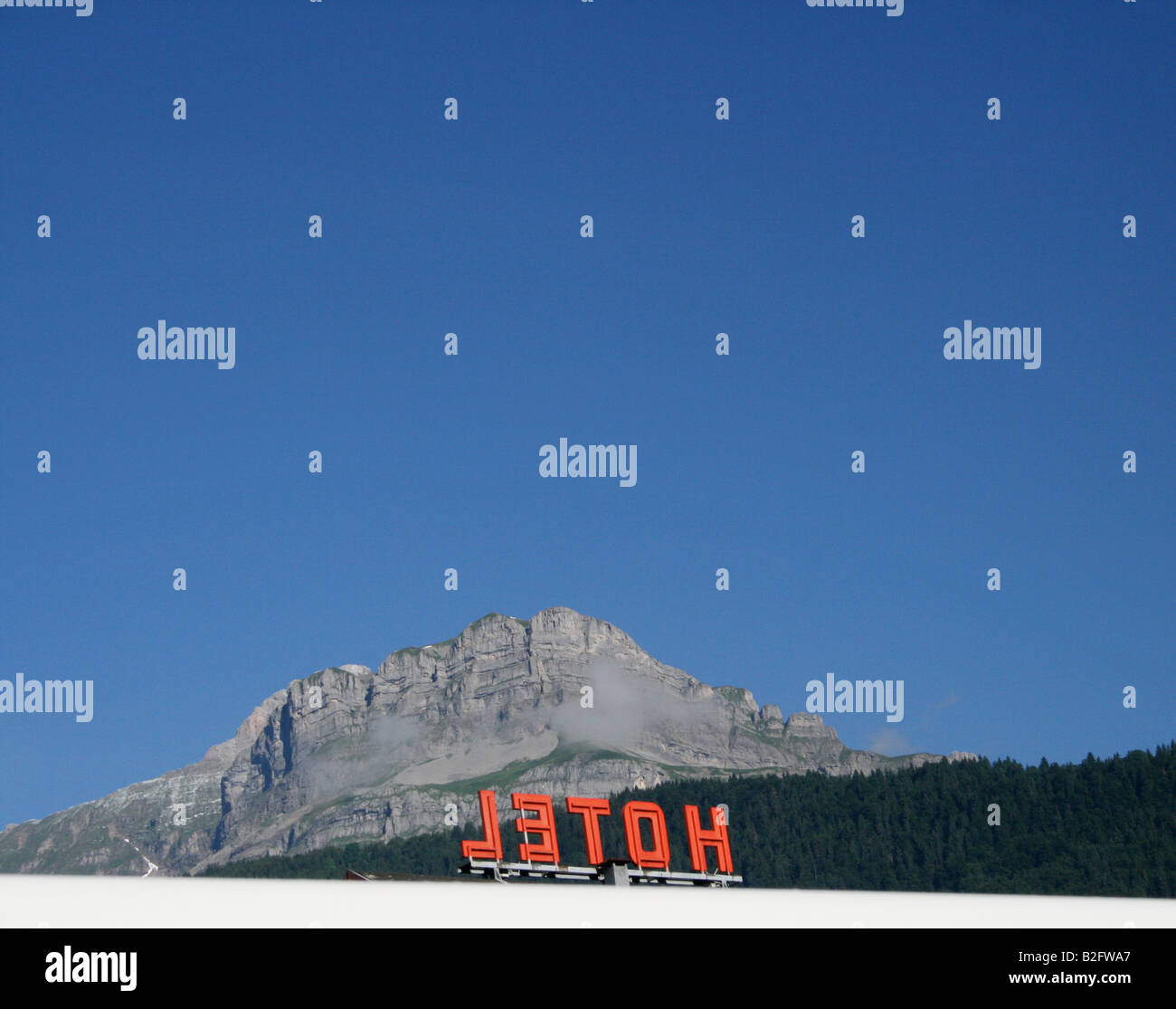 View of Hotel sign and mountain in background in Chamonix, Mont-Blanc ...