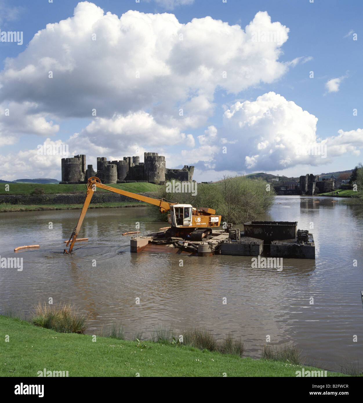 Dredging the Moat at Caerphilly Castle Stock Photo - Alamy