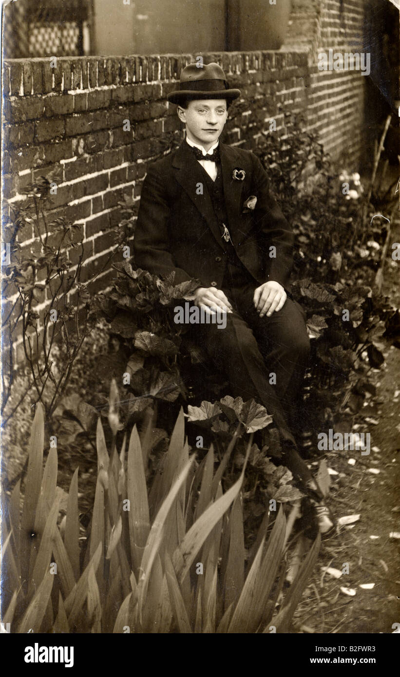 Circa 1910 black and white portrait of a teenage man, wearing a suit ...