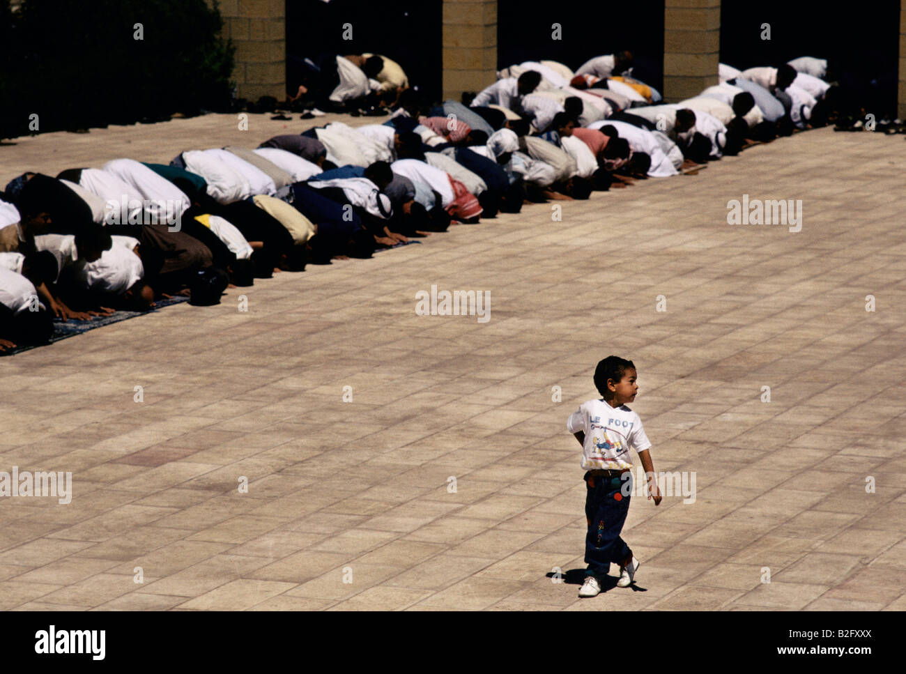 Child Kneeling In Prayer