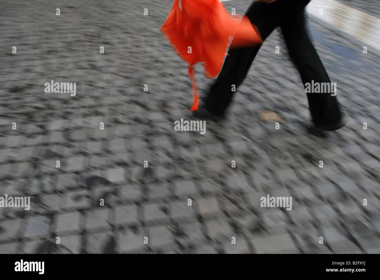 person carrying colourful closed umbrella in town Stock Photo - Alamy
