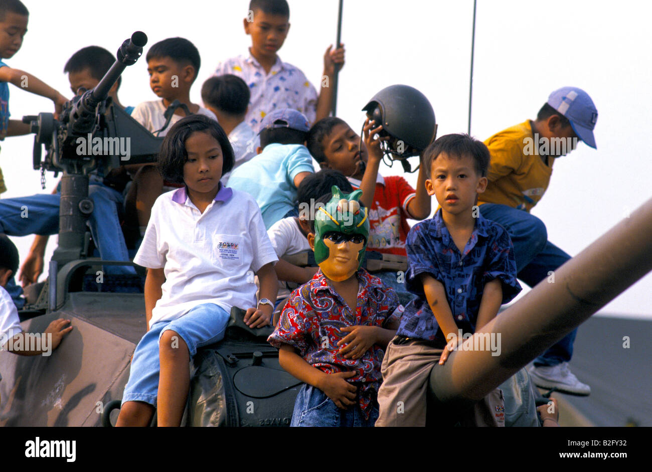 Children riding an army tank on Kids' Day - when the army gives a free ...