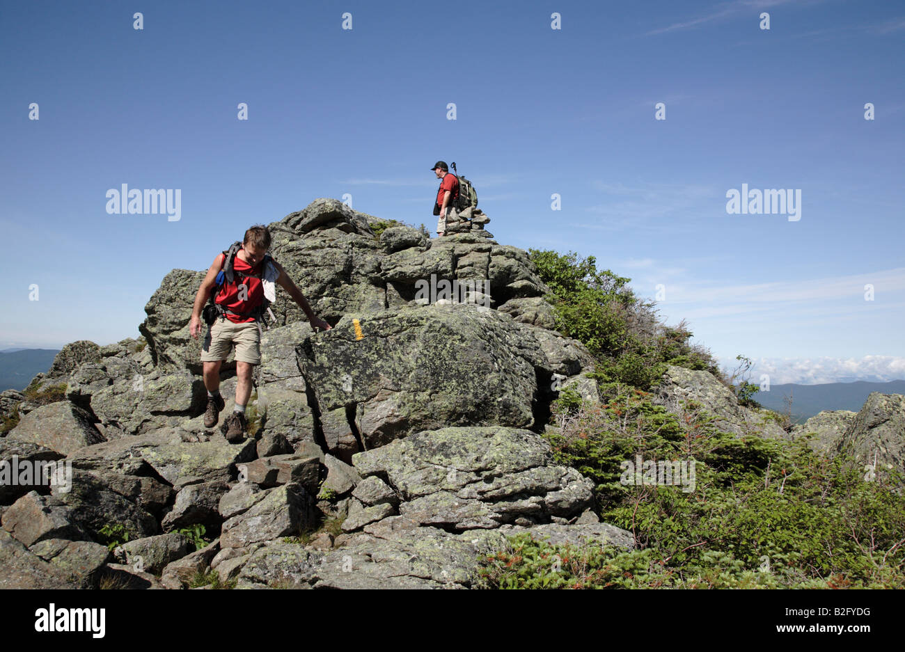 Hikers climb Caps Ridge Trail during the summer months Located in the ...