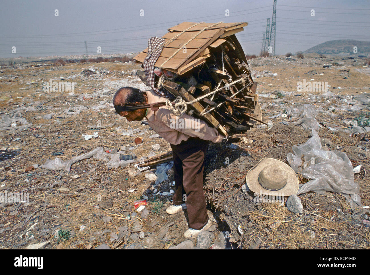Man carrying heavy load on back hi-res stock photography and images - Alamy