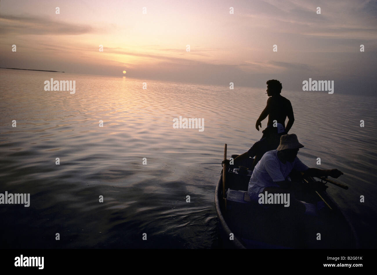 two men in a rowing boat at baracoa cayo largo Stock Photo - Alamy