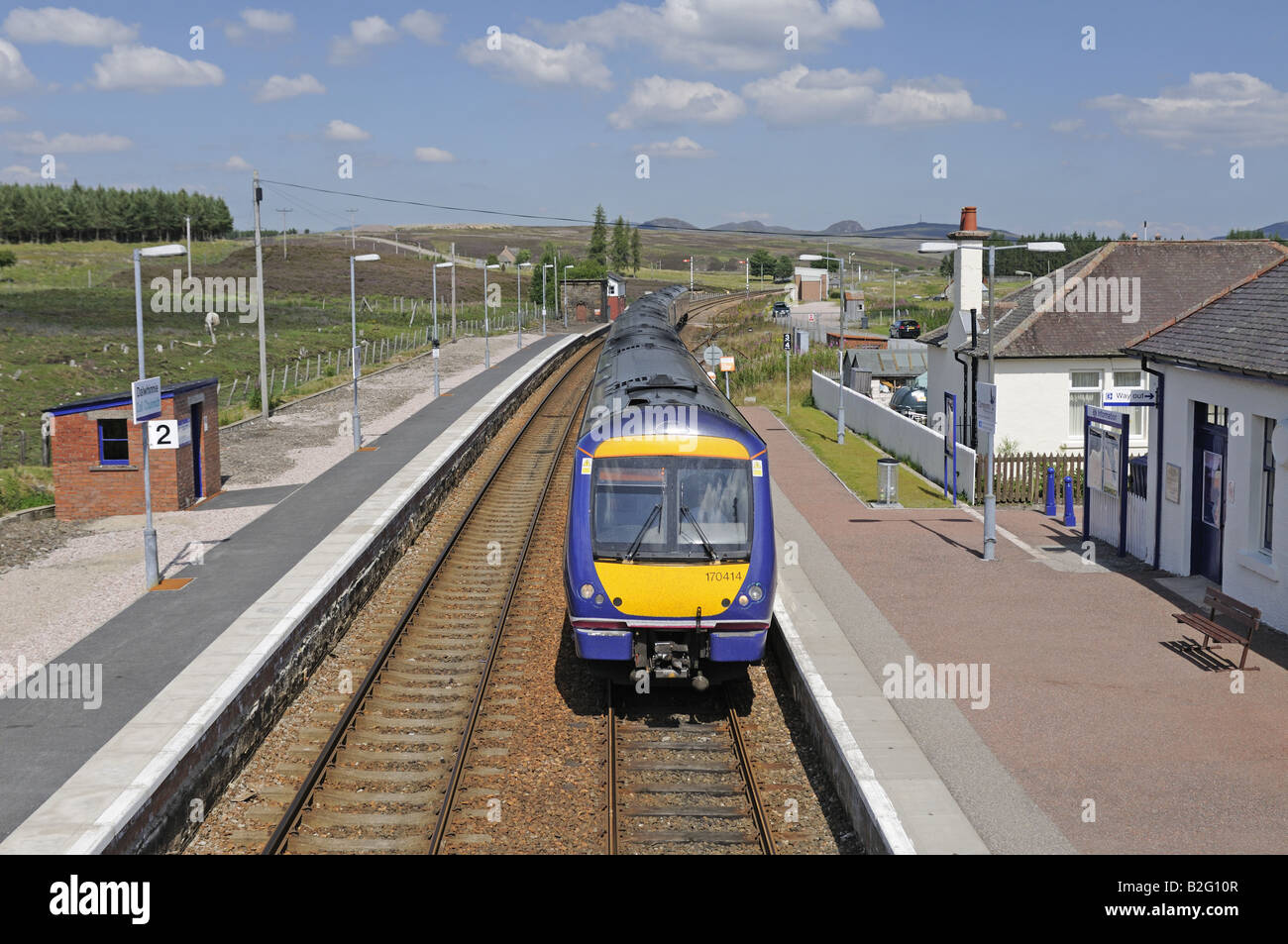 Network Rail passenger train entering Dalwhinnie railway Station ...