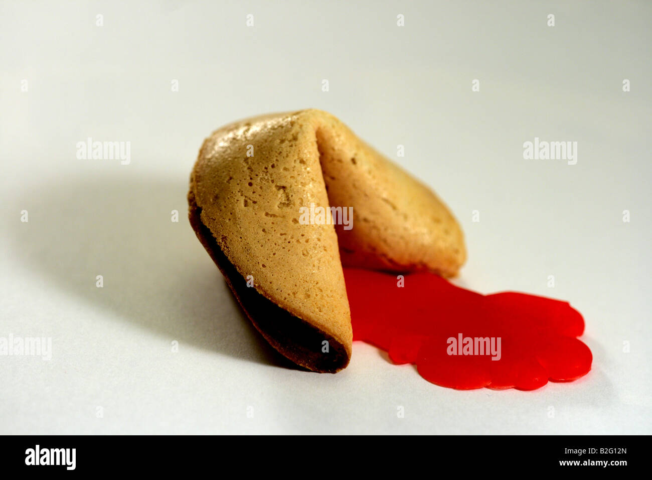 fortune cookie bleeding Stock Photo - Alamy