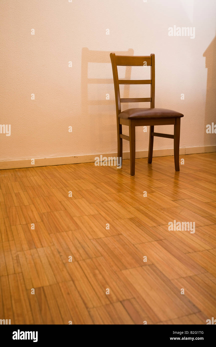 Chair in a empty room Stock Photo - Alamy