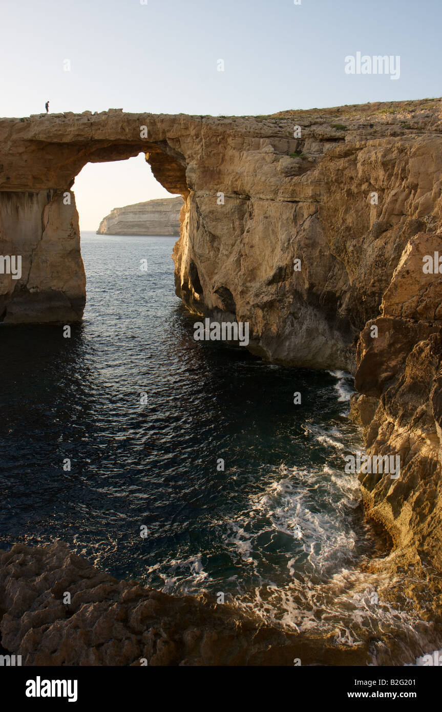 Man standing on rock formation on coast of island of Gozo, Malta Stock ...