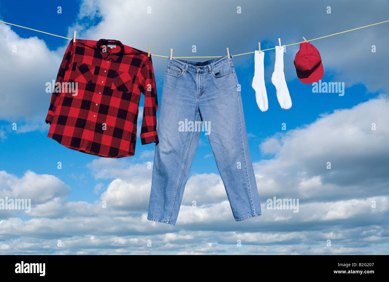 Clothes hanging on clothes line Stock Photo - Alamy