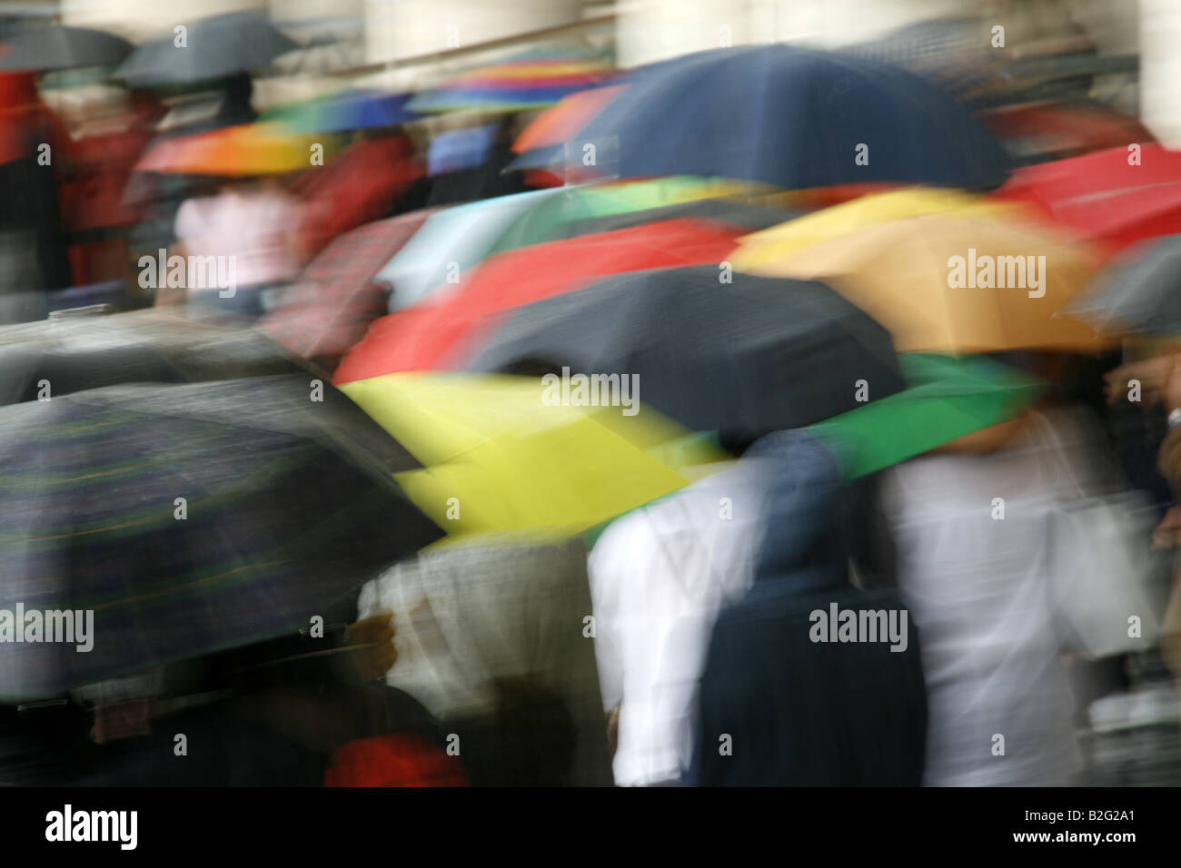 crowd of people with umbrellas in rain in town Stock Photo - Alamy