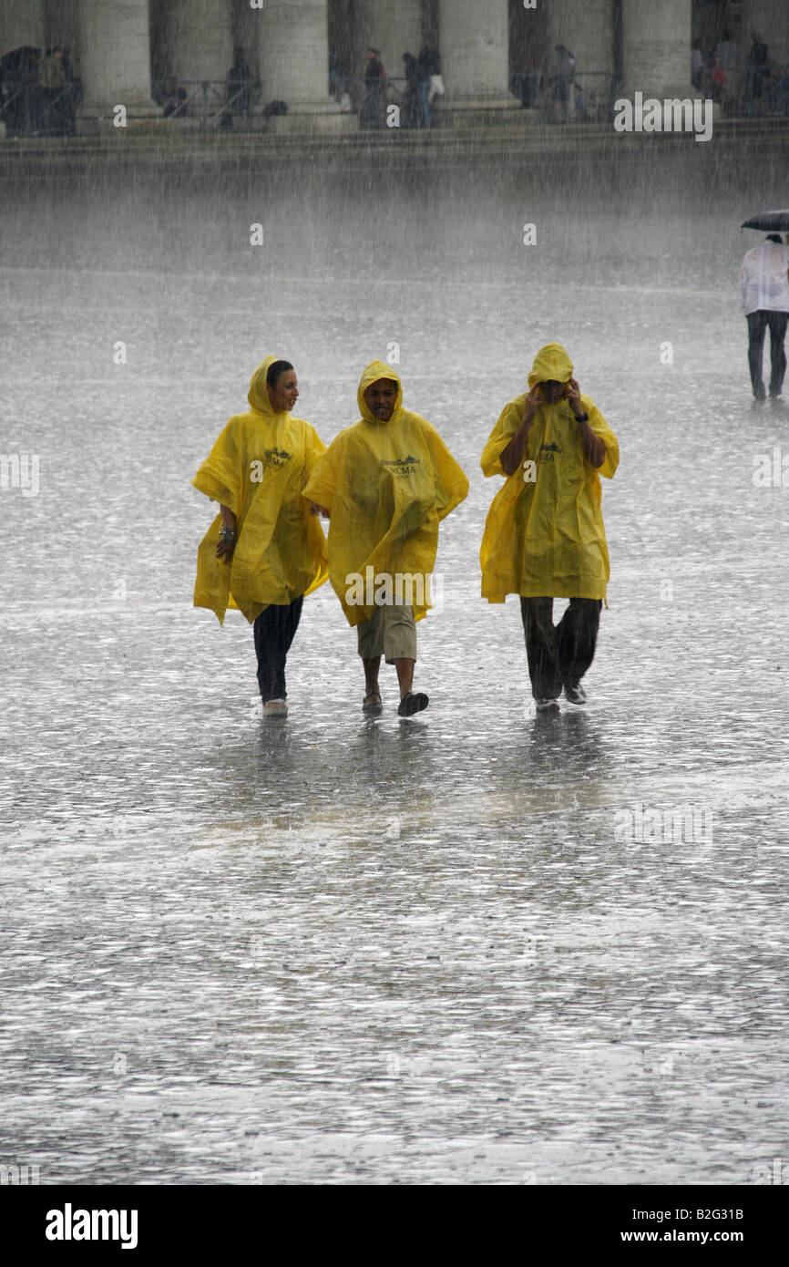 Women running for cover in heavy rain hi-res stock photography and ...