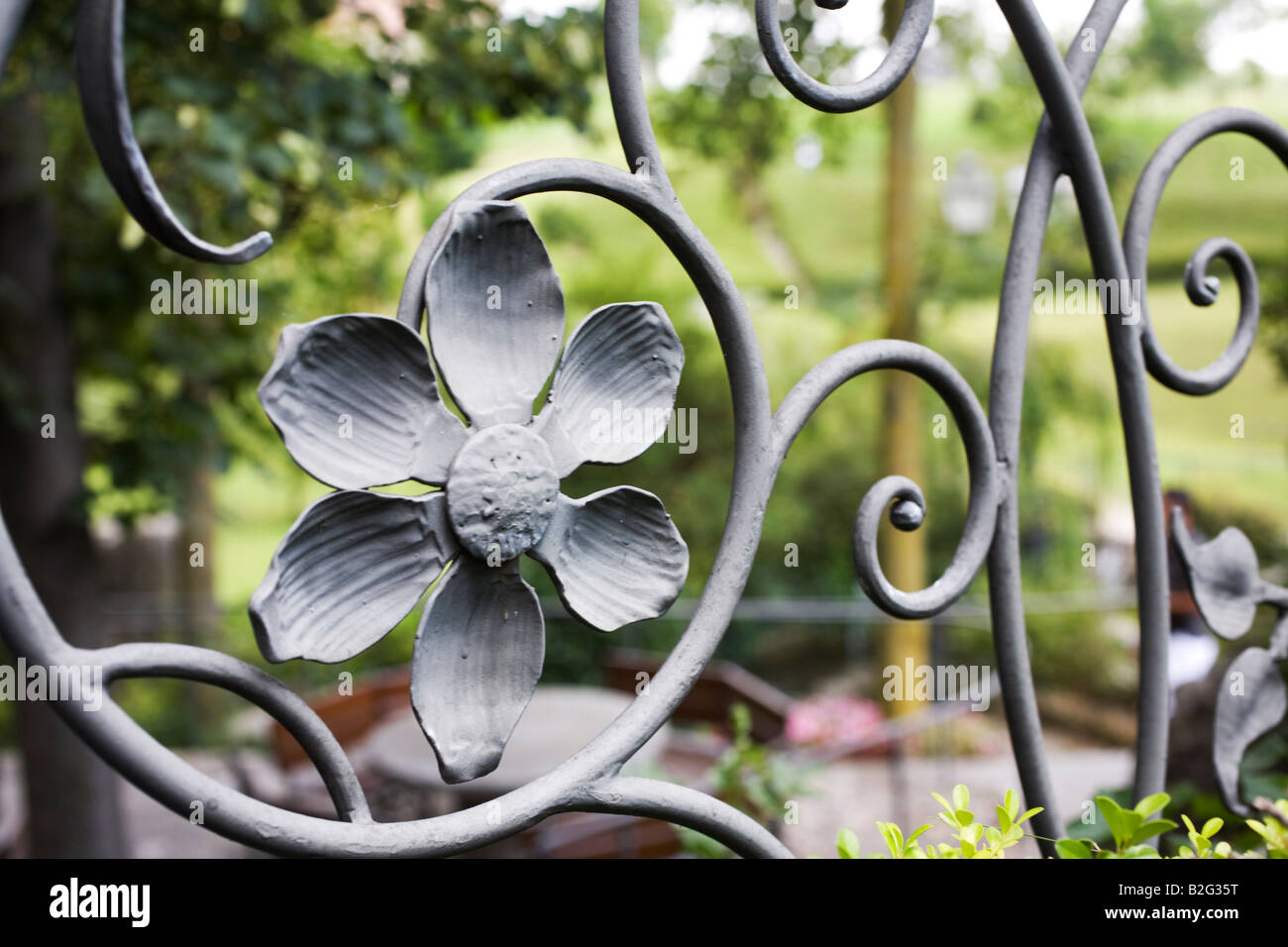 Hand-made iron gate with floral design Stock Photo - Alamy
