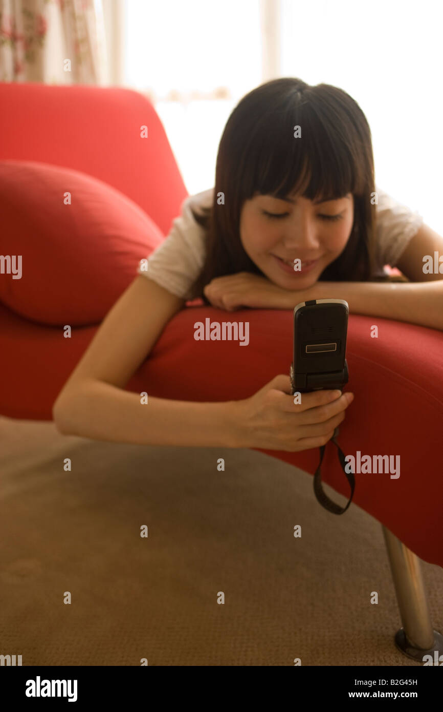 Asian woman pressing phone using hi-res stock photography and images ...