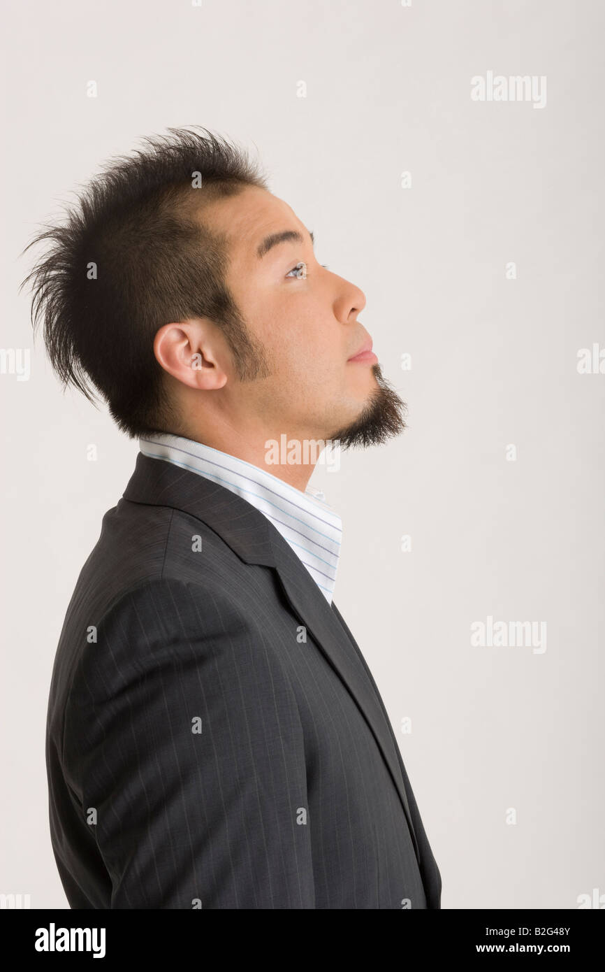 Side profile of a businessman thinking Stock Photo - Alamy
