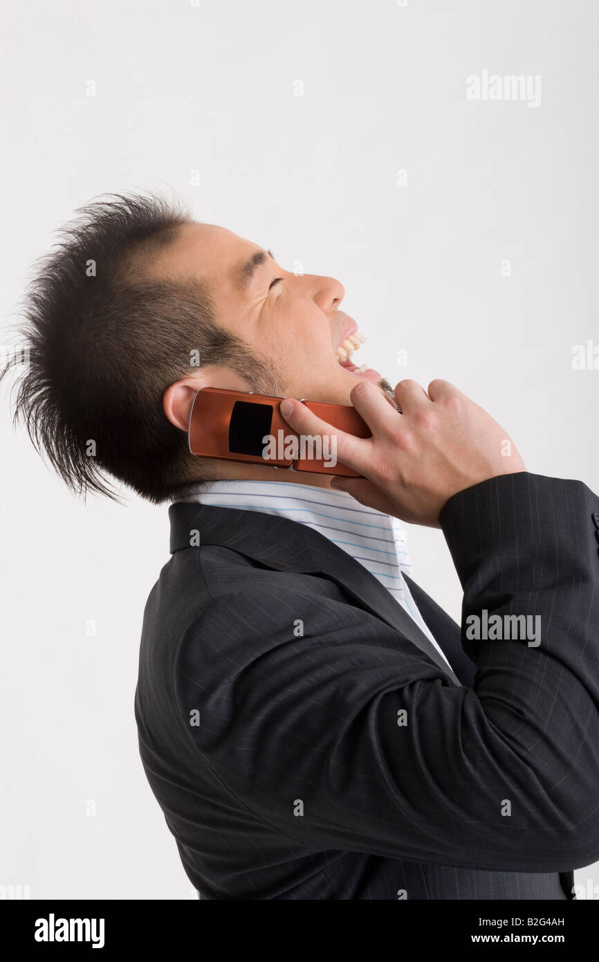 Man laughing on phone profile hi-res stock photography and images - Alamy
