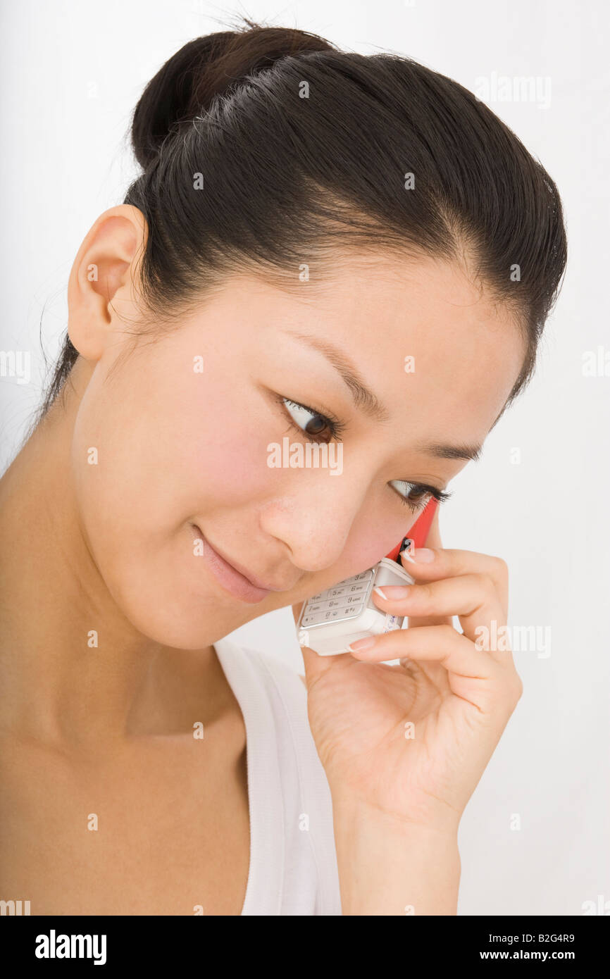 Close-up of a young woman talking on a mobile phone Stock Photo - Alamy