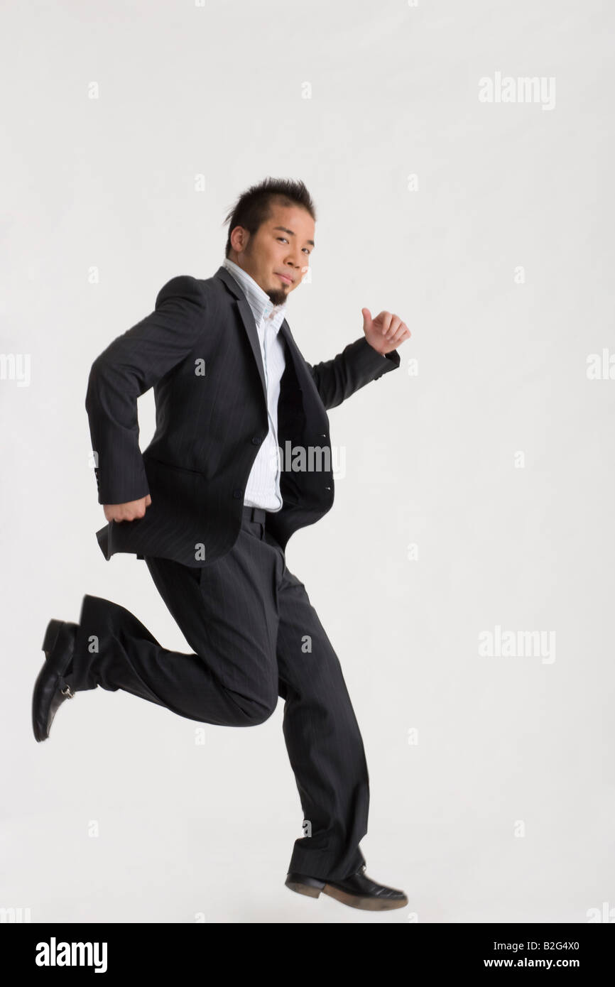 Portrait of a businessman running Stock Photo - Alamy