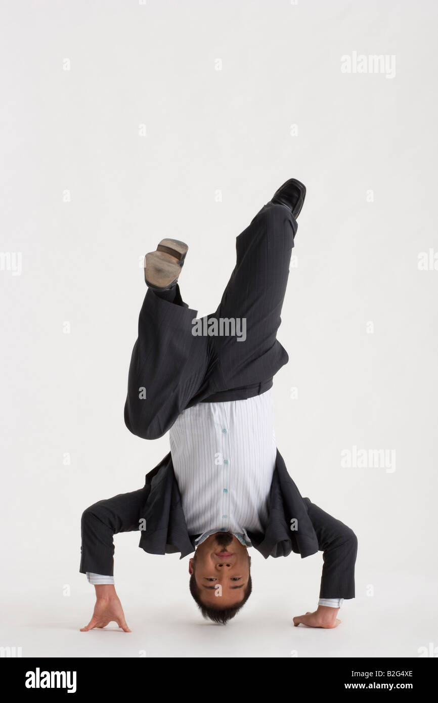 Businessman doing handstand hi-res stock photography and images - Alamy