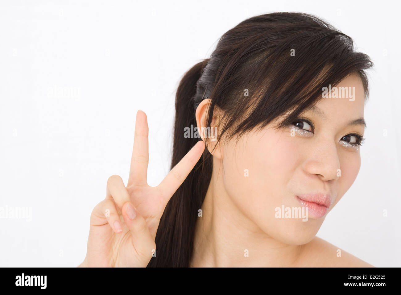Asian Tourists Peace Sign