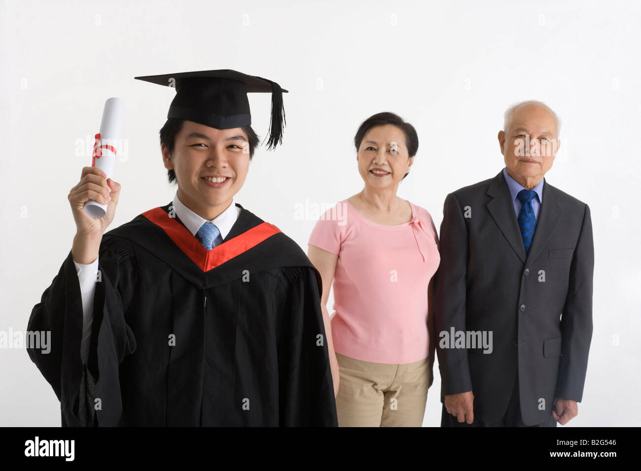 Parents standing with their graduate son hi-res stock photography and ...