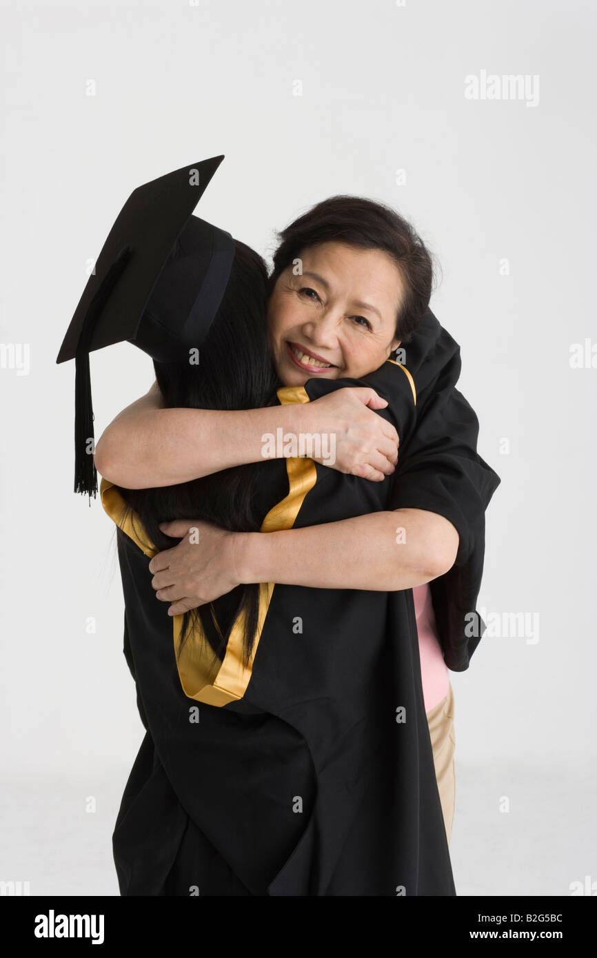 Rear view of a young female graduate hugging her mother Stock Photo - Alamy
