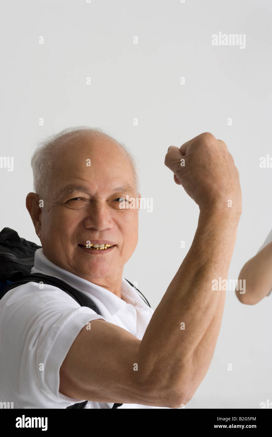 Man showing bicep senior hi-res stock photography and images - Alamy