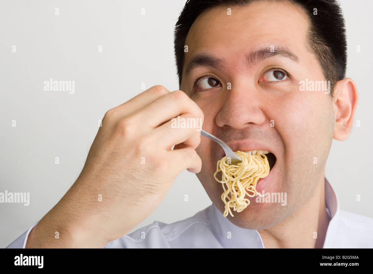 Man tasting fork hi-res stock photography and images - Alamy