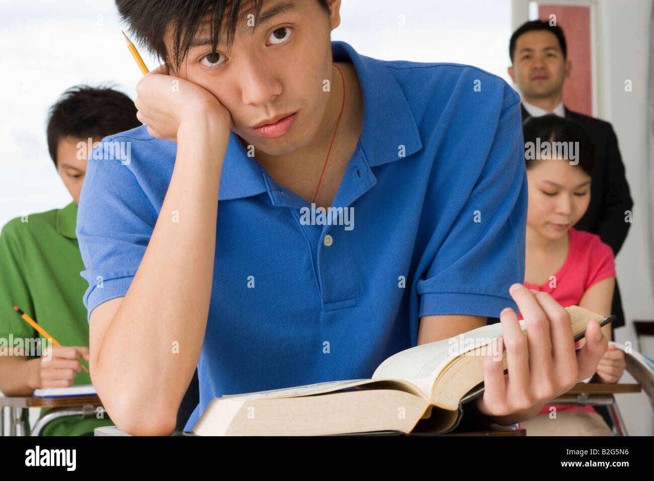 Students studying in a classroom Stock Photo - Alamy