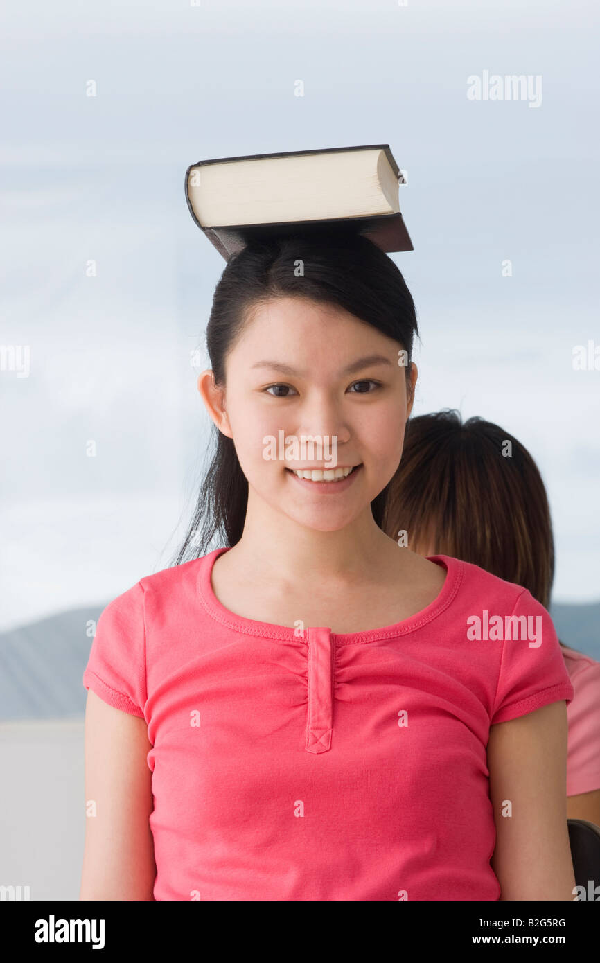 Woman balancing book head hi-res stock photography and images - Alamy