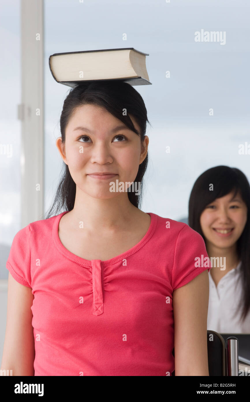 Woman balancing book head hi-res stock photography and images - Alamy