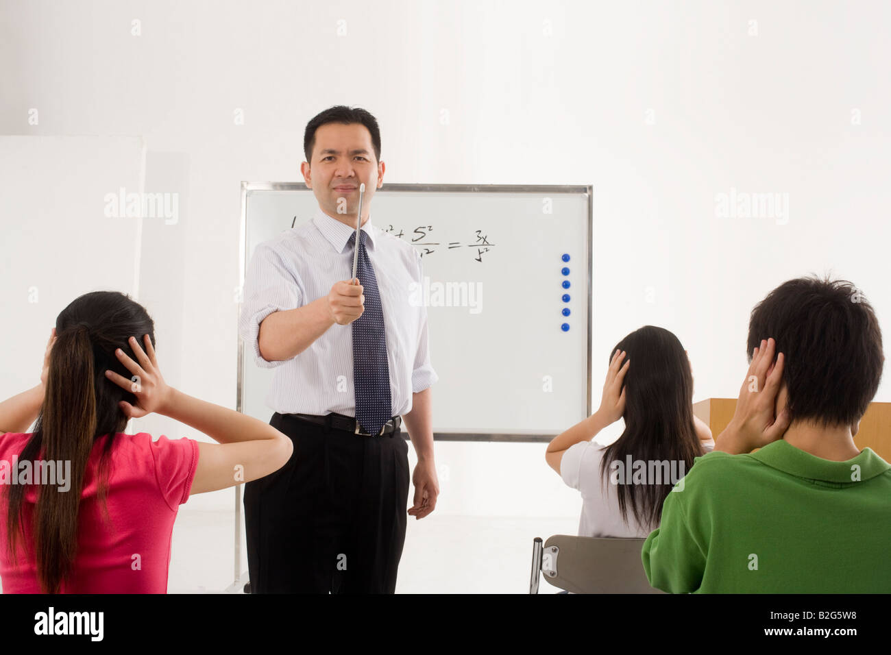 Male professor scolding students Stock Photo - Alamy