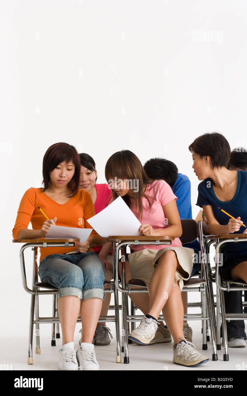 Group of college students giving exam in a classroom Stock Photo - Alamy