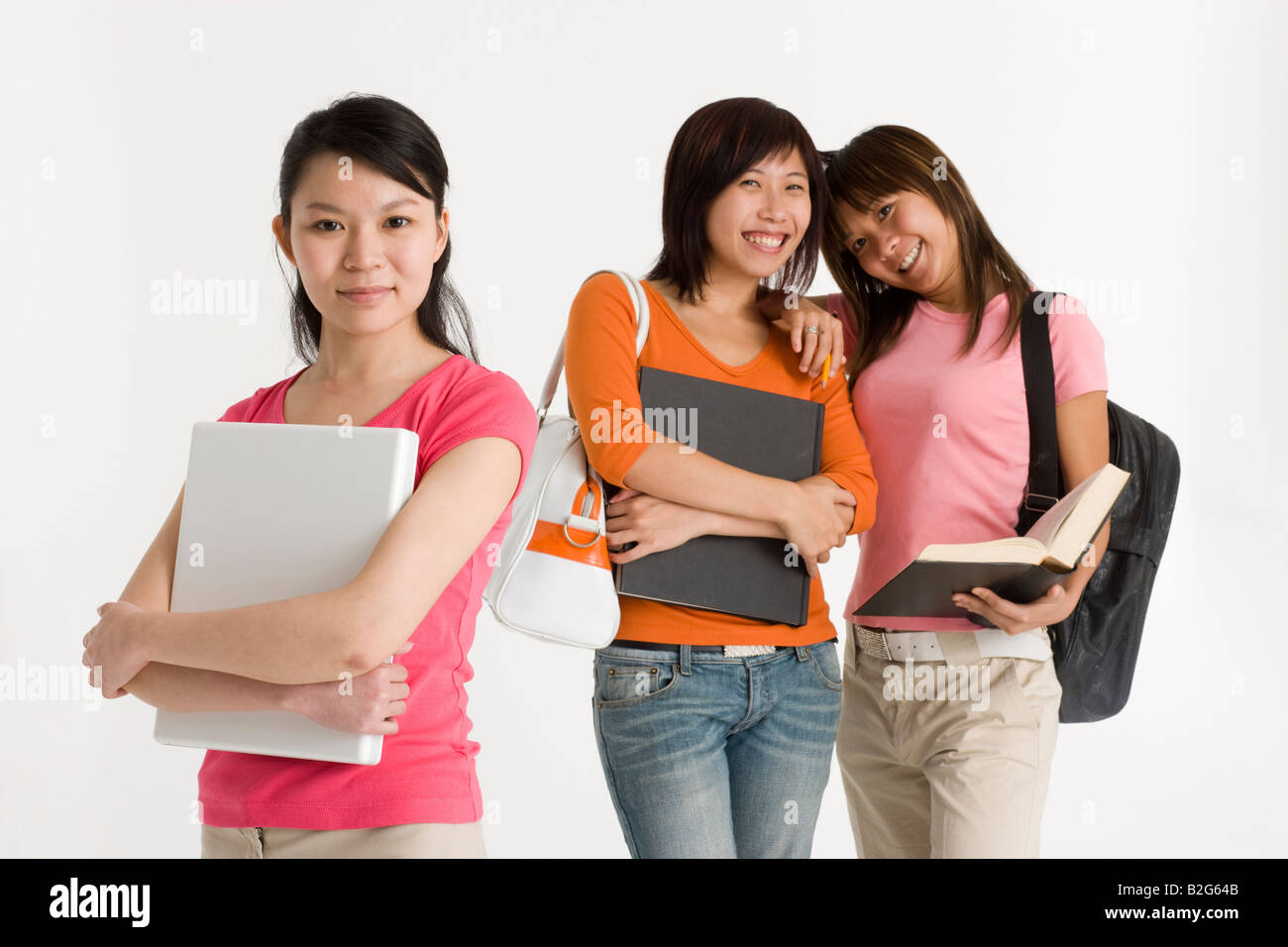 University student carrying laptop smiling hi-res stock photography and ...