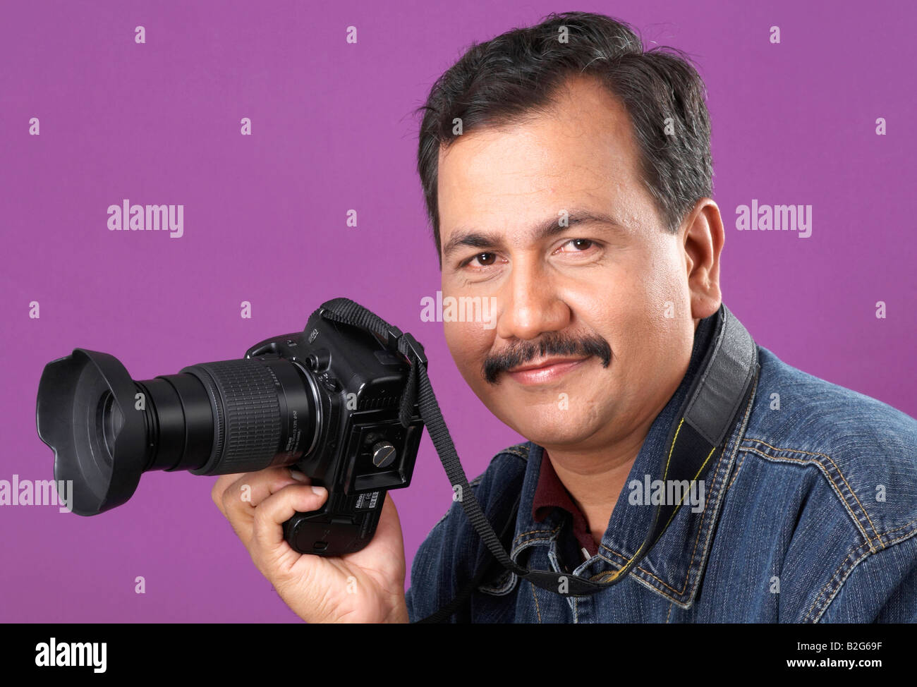 Photographer with his camera Stock Photo - Alamy
