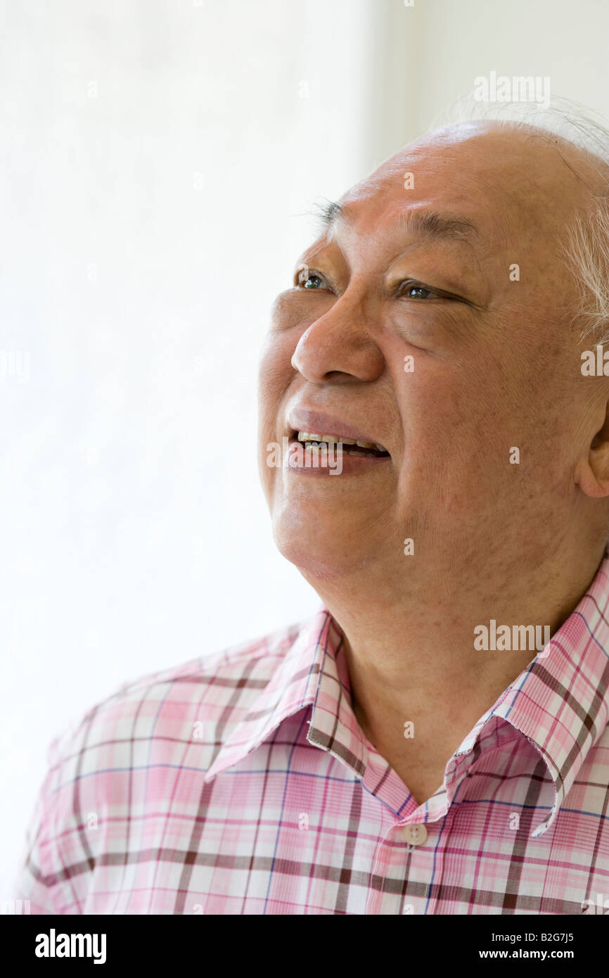 Close-up of a senior man thinking Stock Photo - Alamy