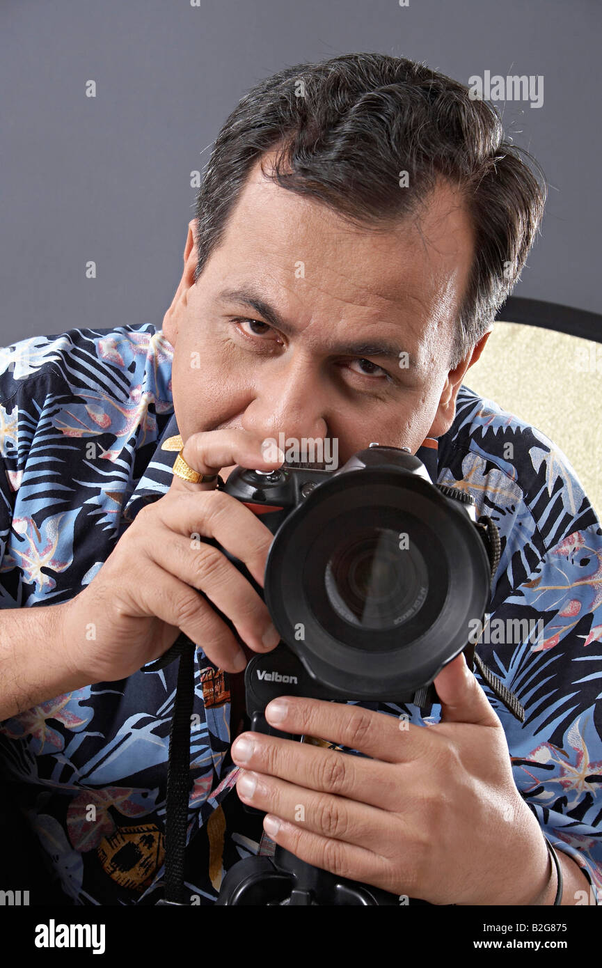 Photographer looking through the lens Stock Photo - Alamy