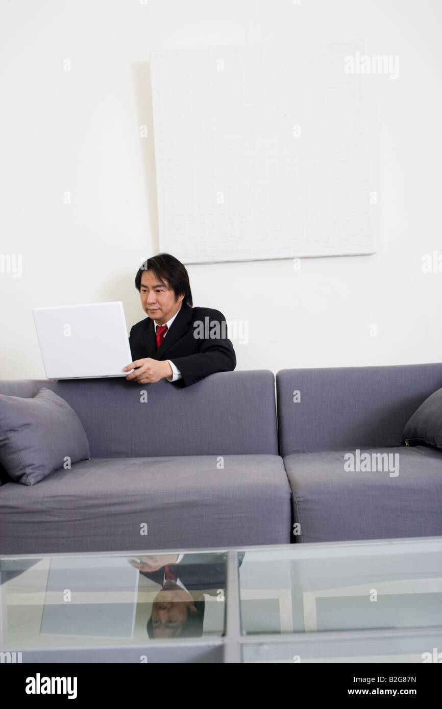 Man working behind laptop hi-res stock photography and images - Alamy