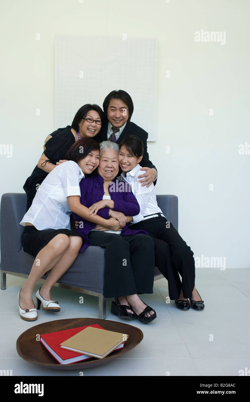 Portrait of a family hugging each other and smiling Stock Photo - Alamy