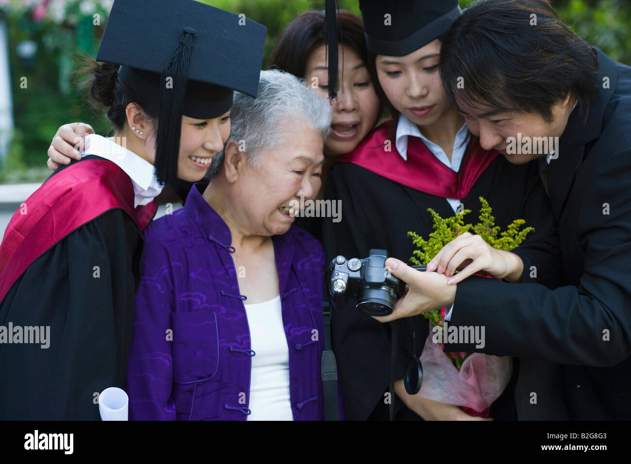 Graduation family standing hi-res stock photography and images - Alamy