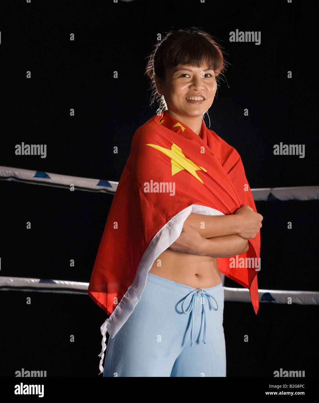 Young woman with a Chinese flag in a boxing ring Stock Photo - Alamy