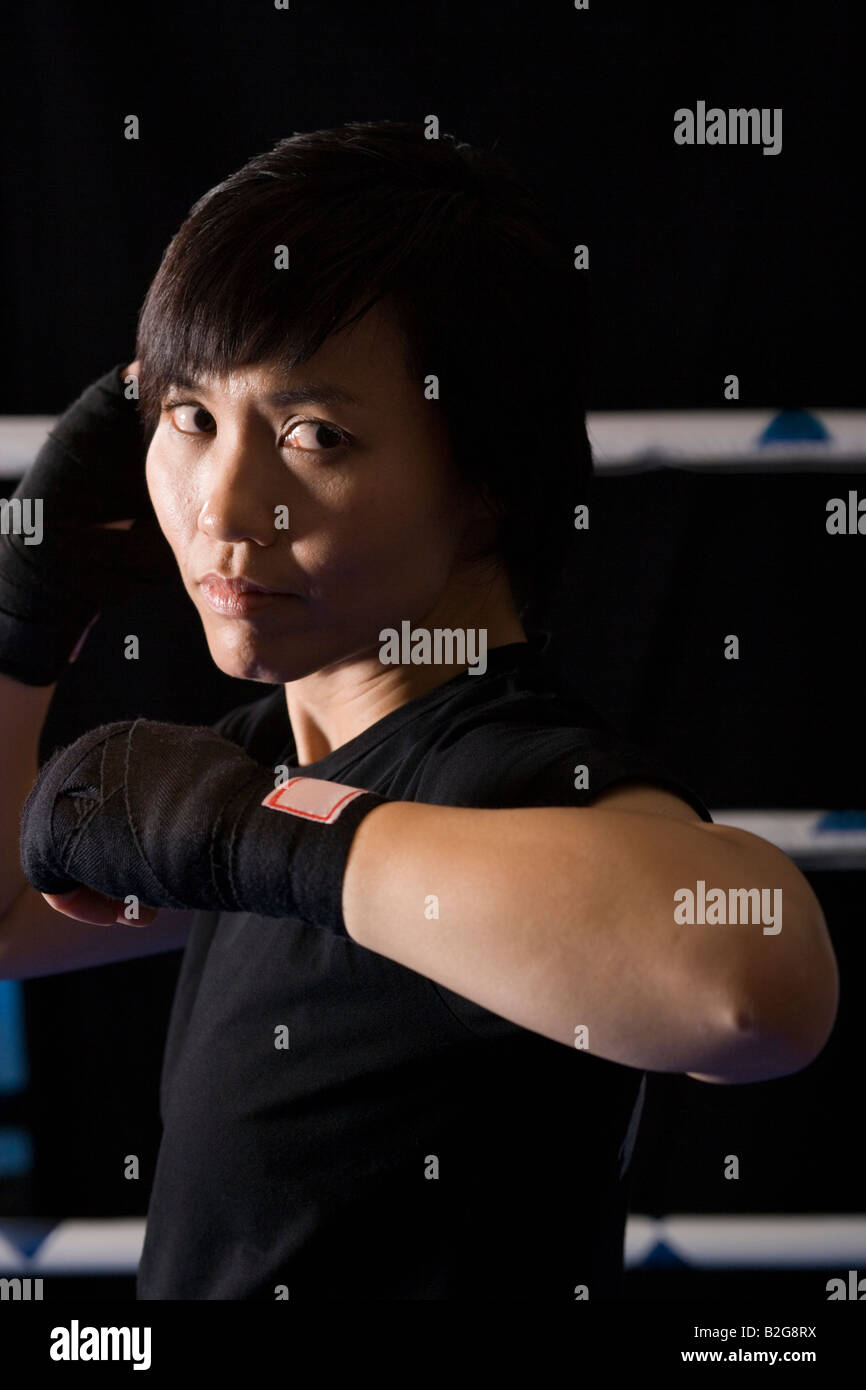 Mid adult woman practicing boxing in a boxing ring Stock Photo - Alamy