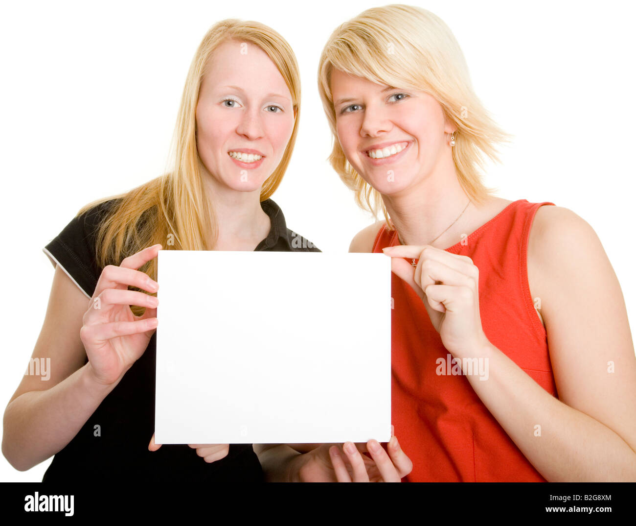 pair couple young women paper sign Stock Photo - Alamy