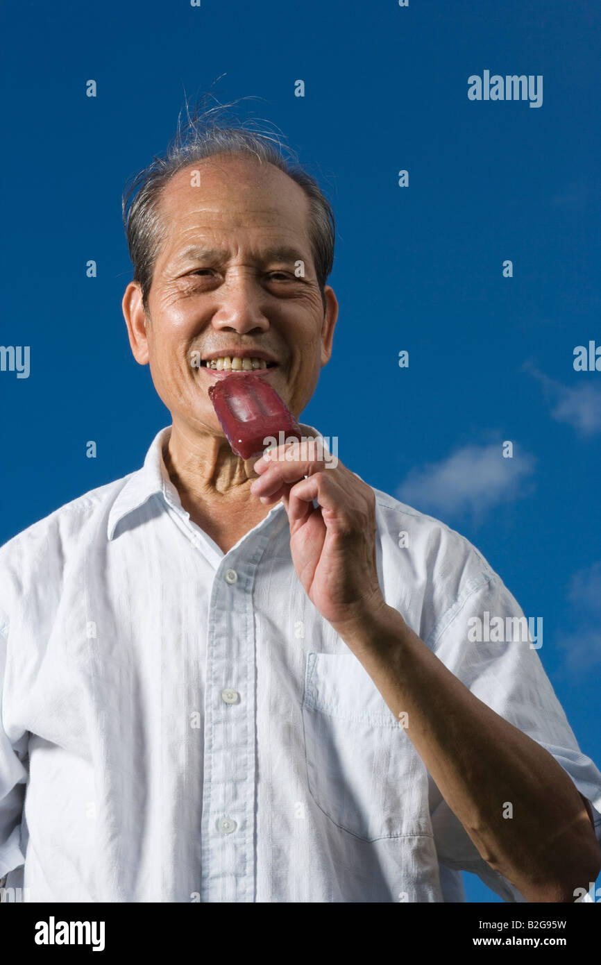 Senior man eating ice cream hi-res stock photography and images - Alamy