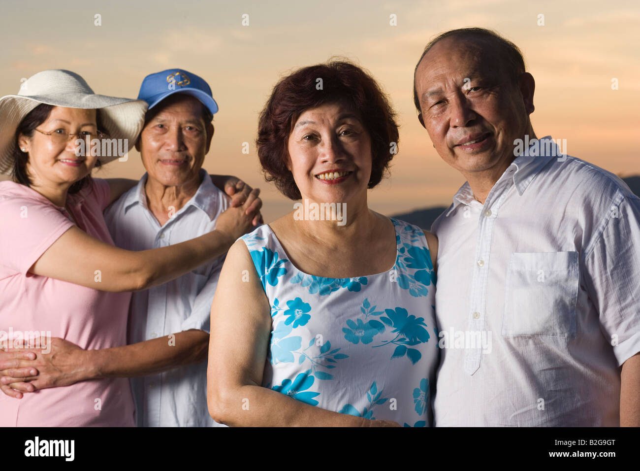 Two mature couples embracing hi-res stock photography and images - Alamy