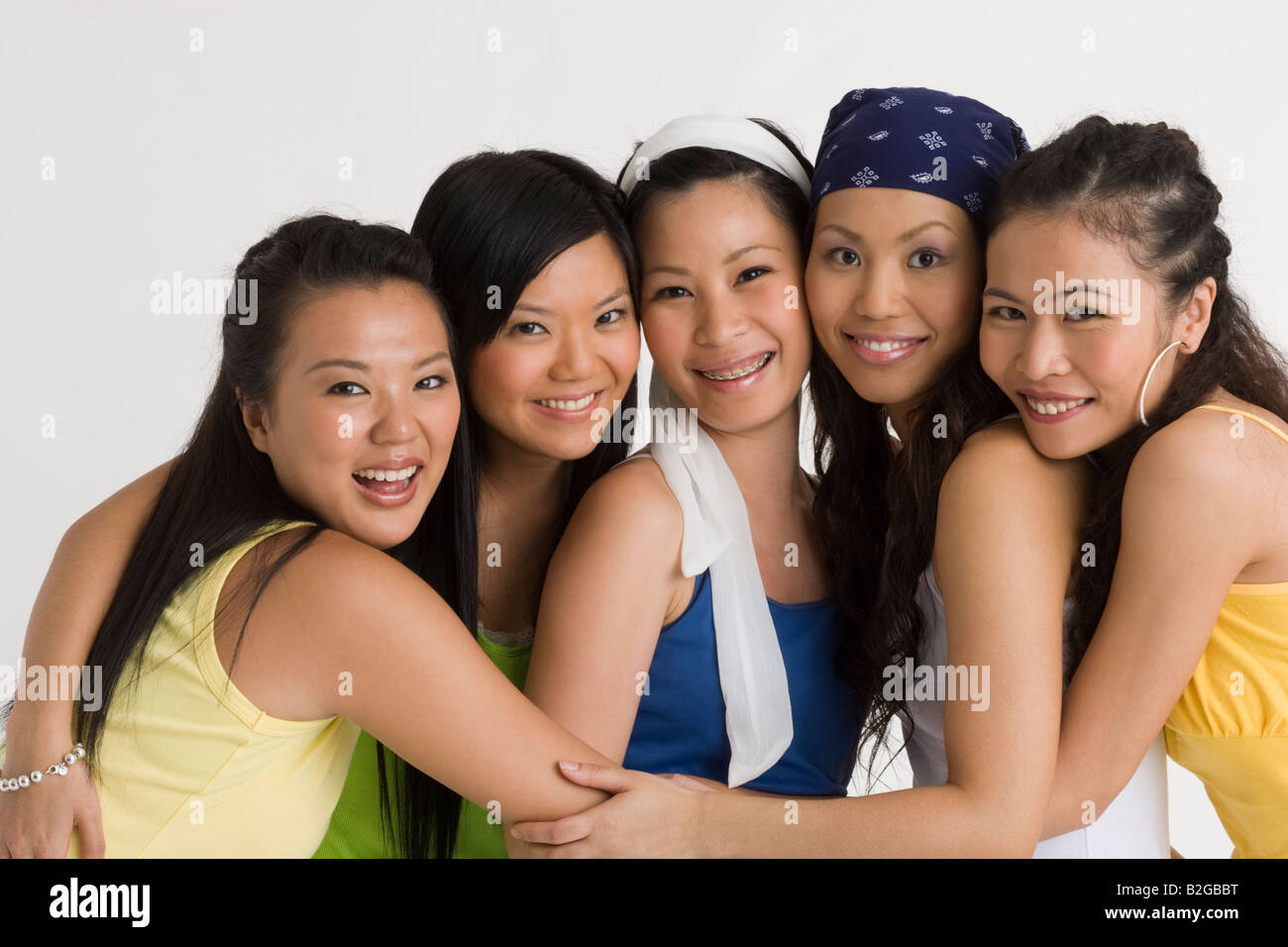 Portrait of five young women hugging each other and smiling Stock Photo ...
