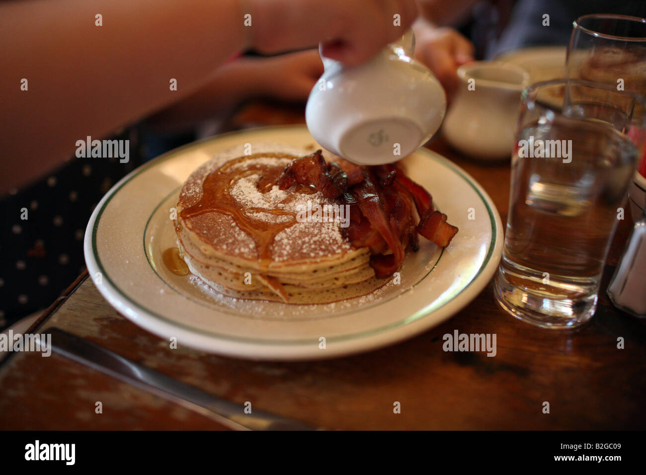 Pancakes, bacon & maple syrup, being served for breakfast in American ...