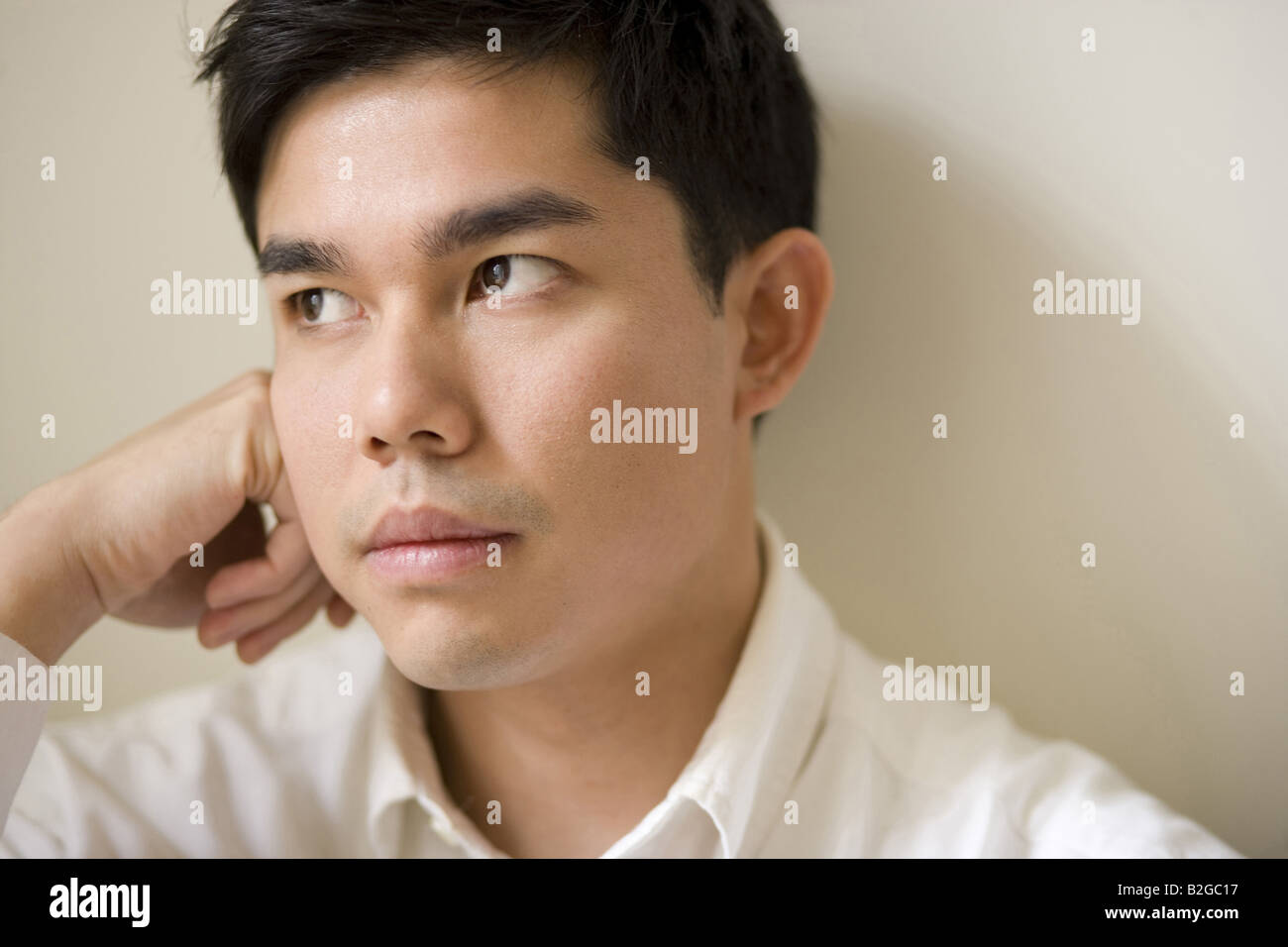 Portrait of a contemplative young man Stock Photo - Alamy