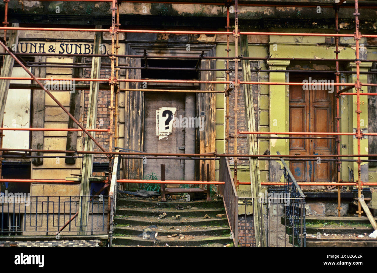 boarded up house with scaffolding outside glasgow 1992 Stock Photo - Alamy